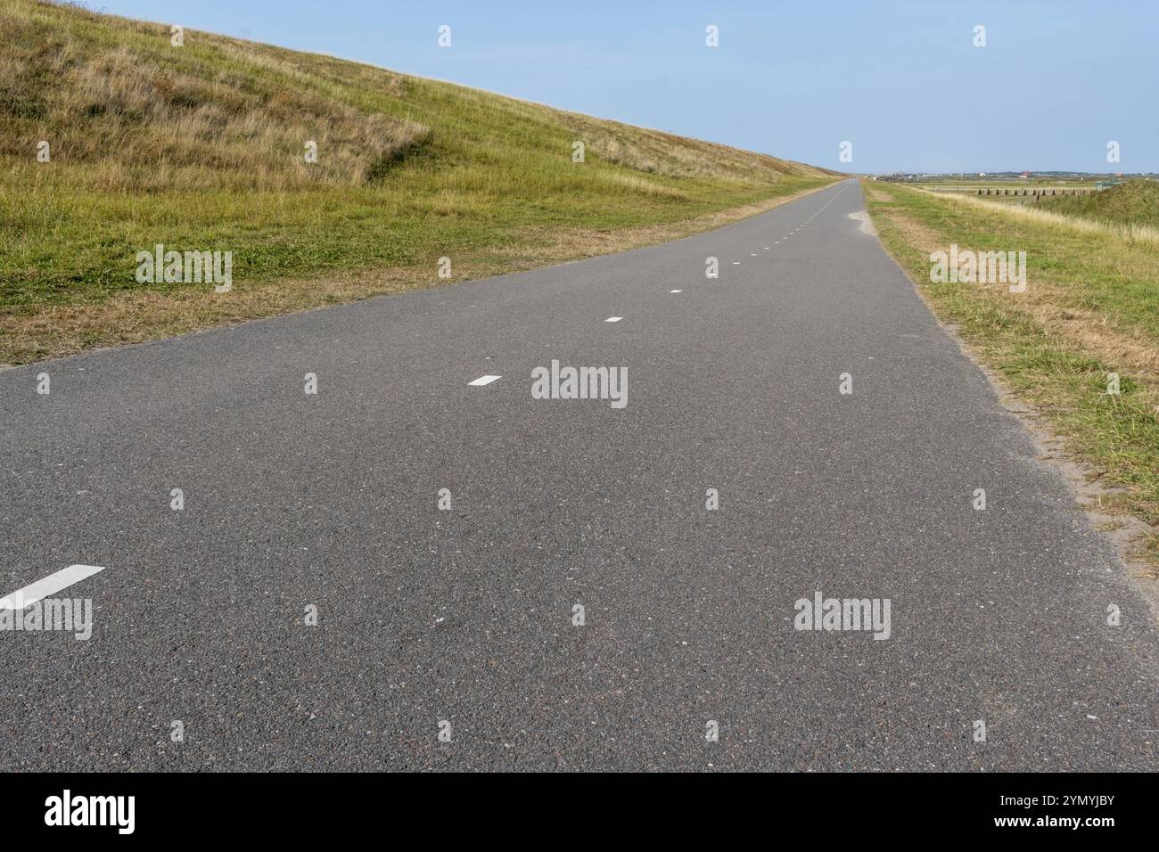 Long cycle path along the dike on the dutch north sea Stock Photo - Alamy