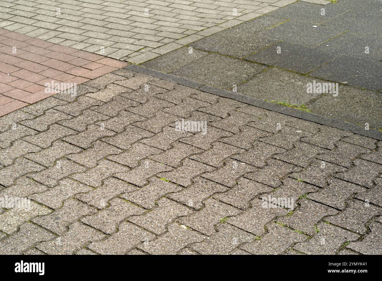 Different paving stones on the sidewalk Stock Photo - Alamy
