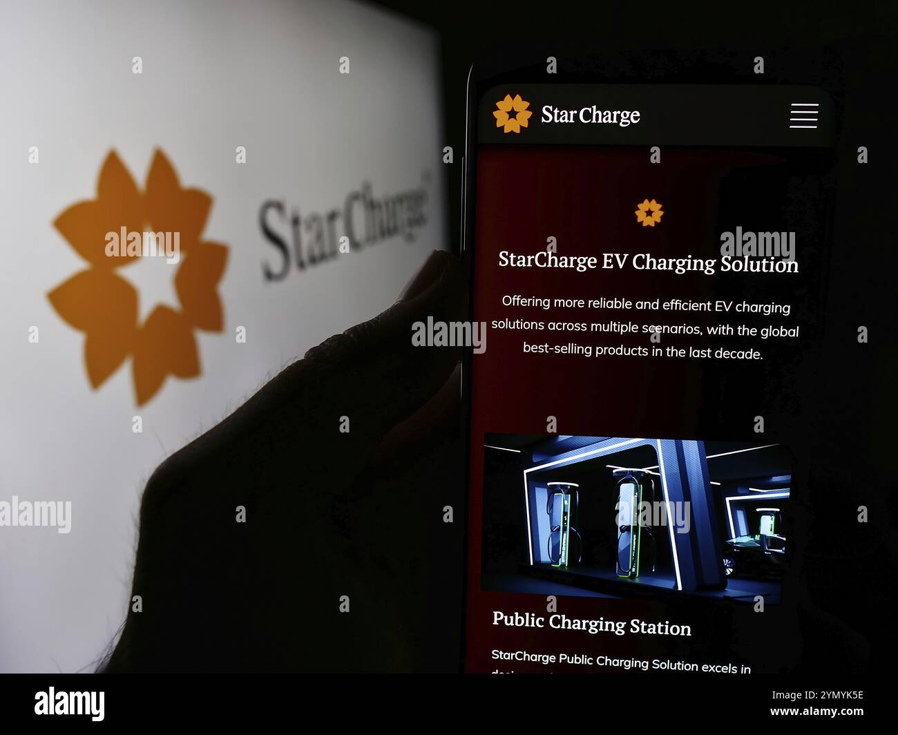 Stuttgart, Germany, 07-14-2024: Person holding smartphone with webpage of Singaporean electric ...