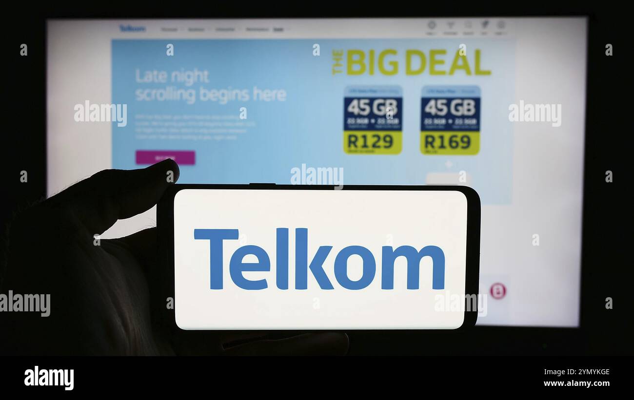 Stuttgart, Germany, 06-11-2024: Person holding mobile phone with logo ...