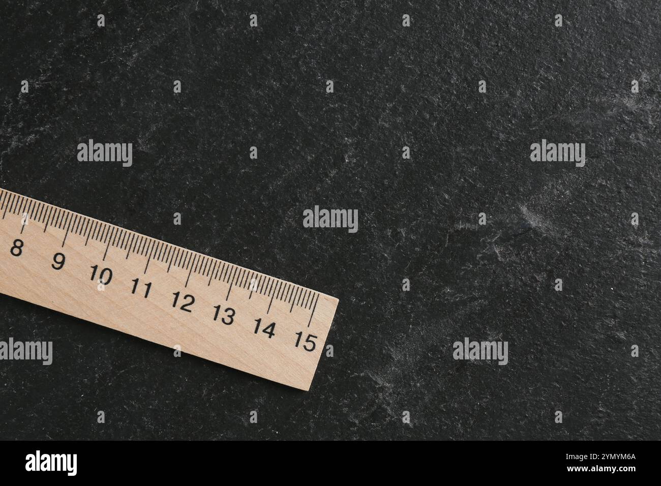 One wooden ruler on black table, top view. Space for text Stock Photo ...