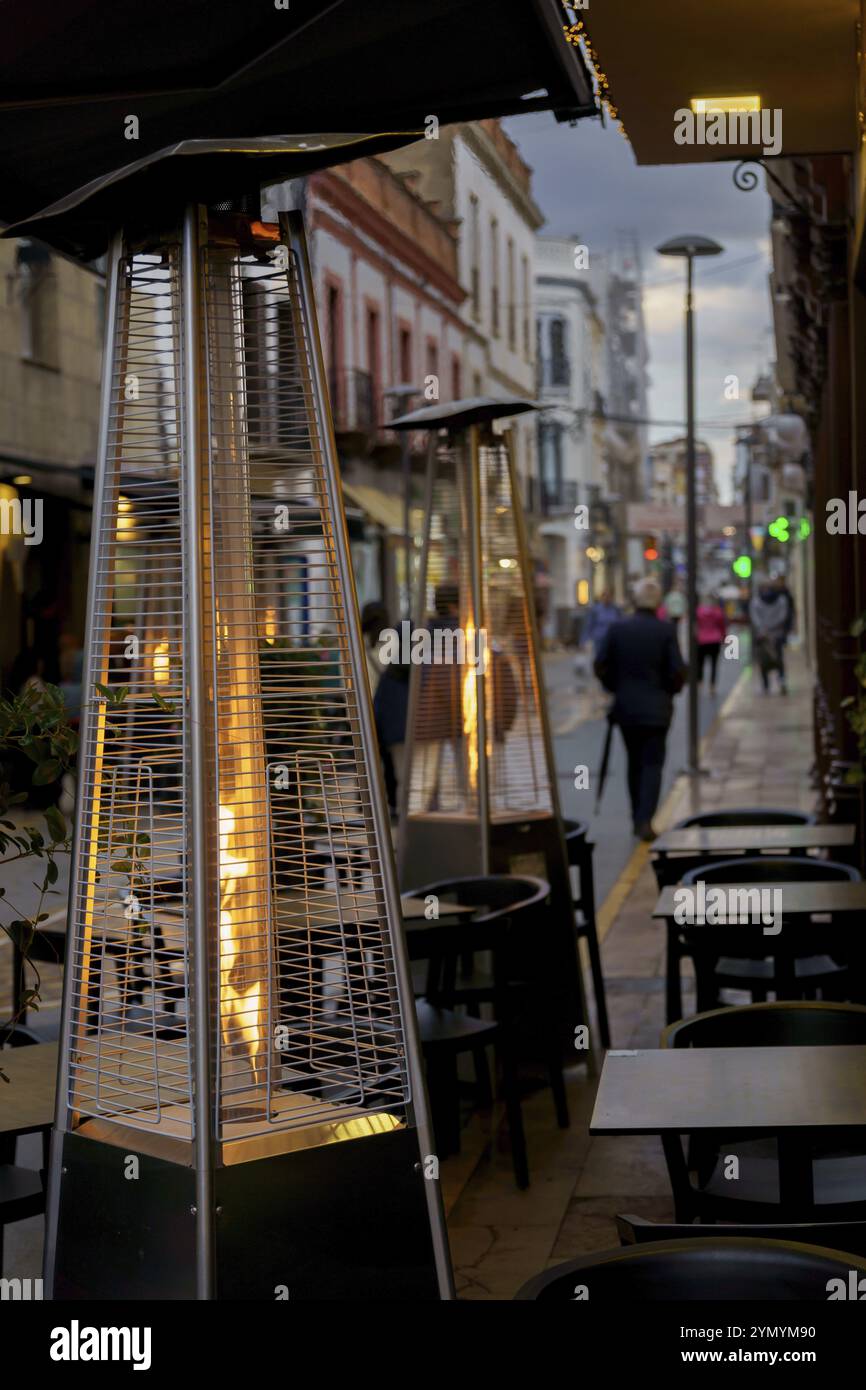 Butane stoves on fire on the terrace of a bar on a pedestrian street in ...