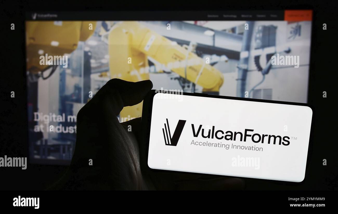 Stuttgart, Germany, 03-27-2024: Person holding mobile phone with logo of American digital ...