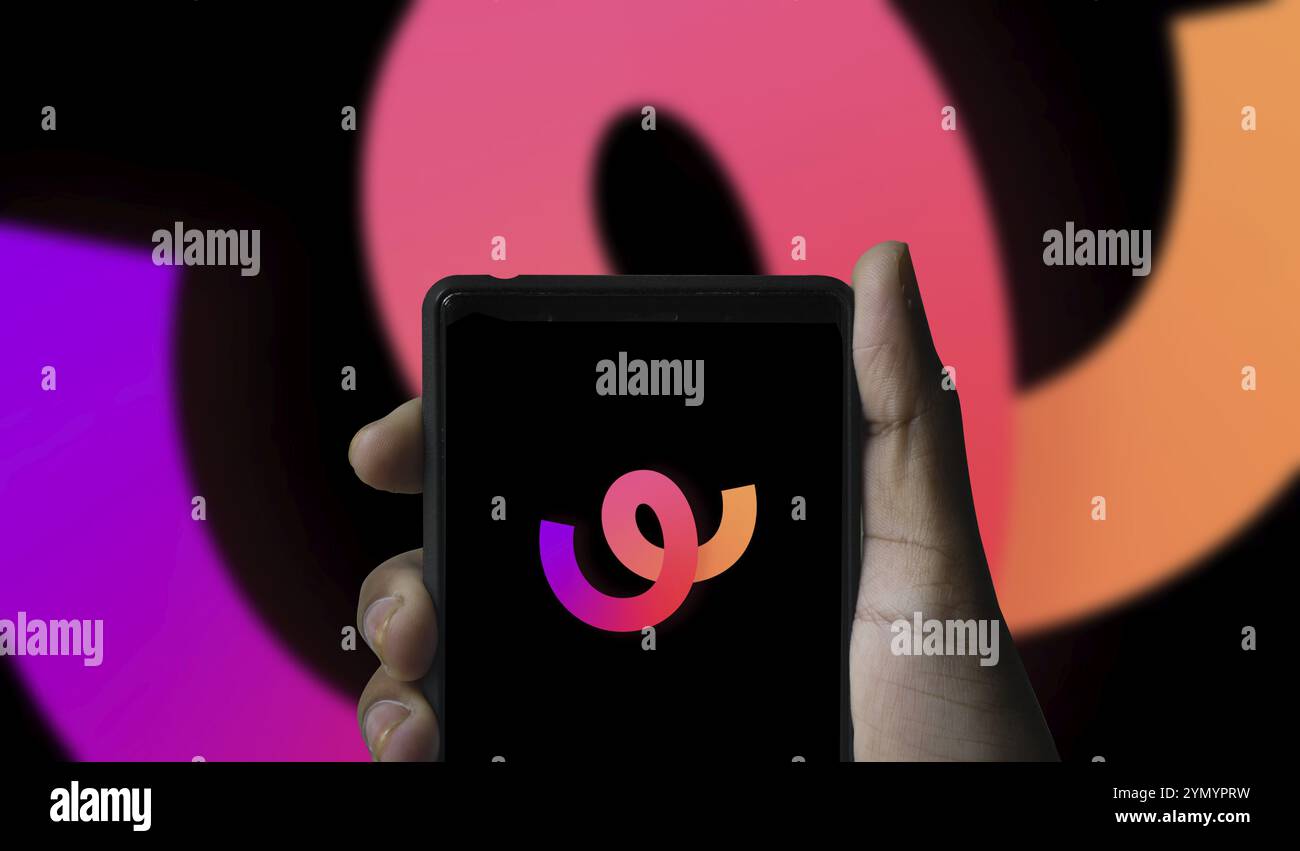 Whee logo is displayed on smartphone. Whee is a new social app owned by ...