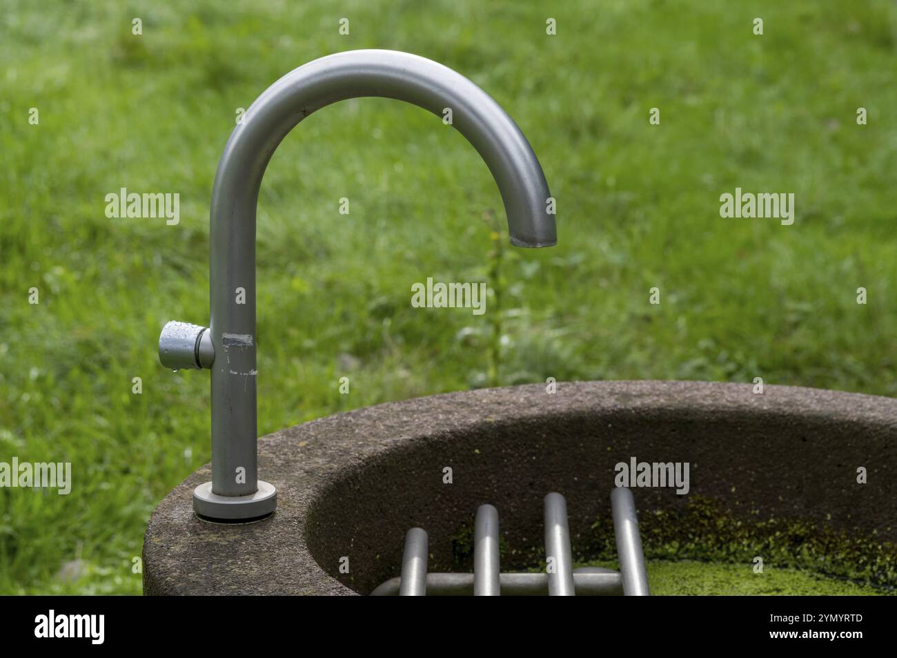 Stainless steel water crane in the park Stock Photo - Alamy