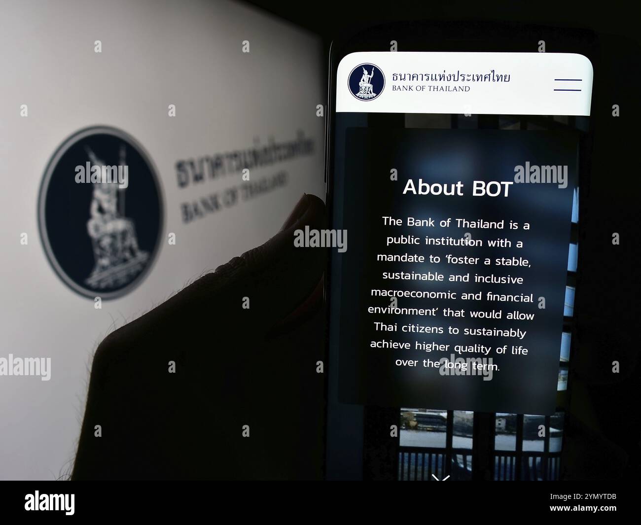 Stuttgart, Germany, 06-24-2024: Person holding cellphone with webpage of Thai financial ...