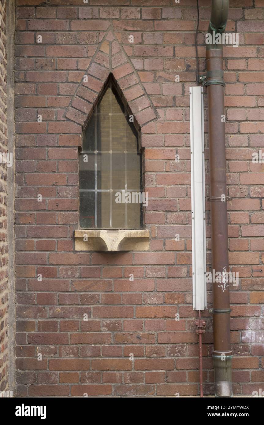 Small church window with downpipe and lightning conductor cable Stock ...