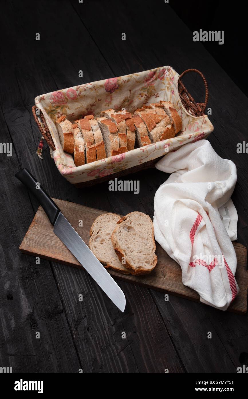 Rustic Bread Display with Sliced Whole Grain Loaf in Wicker Basket on ...