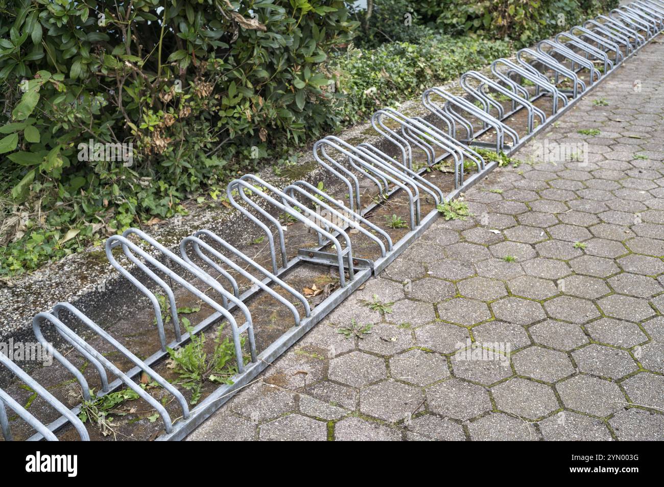 Row of bicycle stands hi-res stock photography and images - Alamy