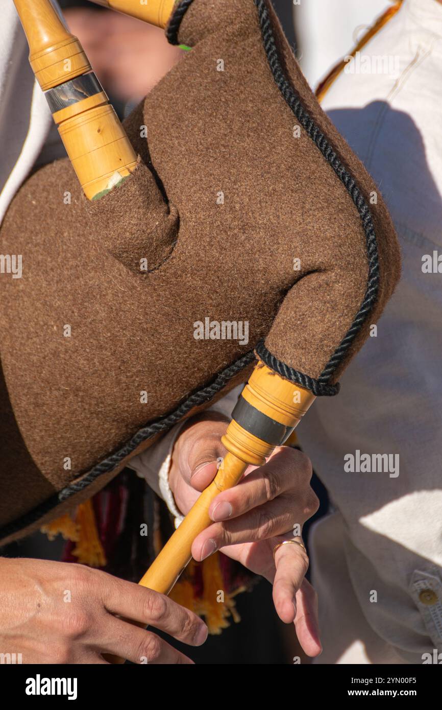 detail of the hands of a bagpipe player playing a traditional bagpipe ...