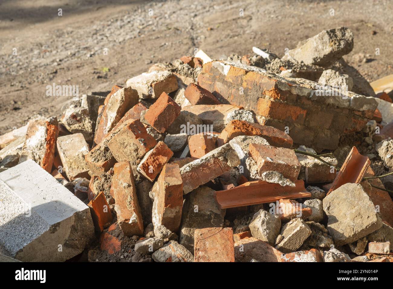 Pile of brick rubble in the sun Stock Photo - Alamy