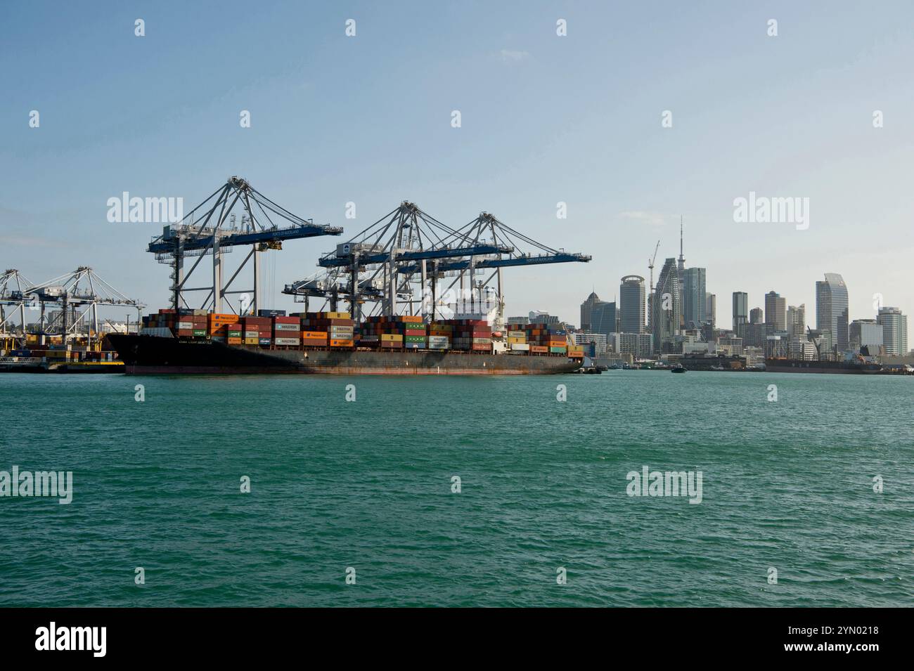 Container ship at dock in Waimata Harbor in Auckland New Zealand being ...