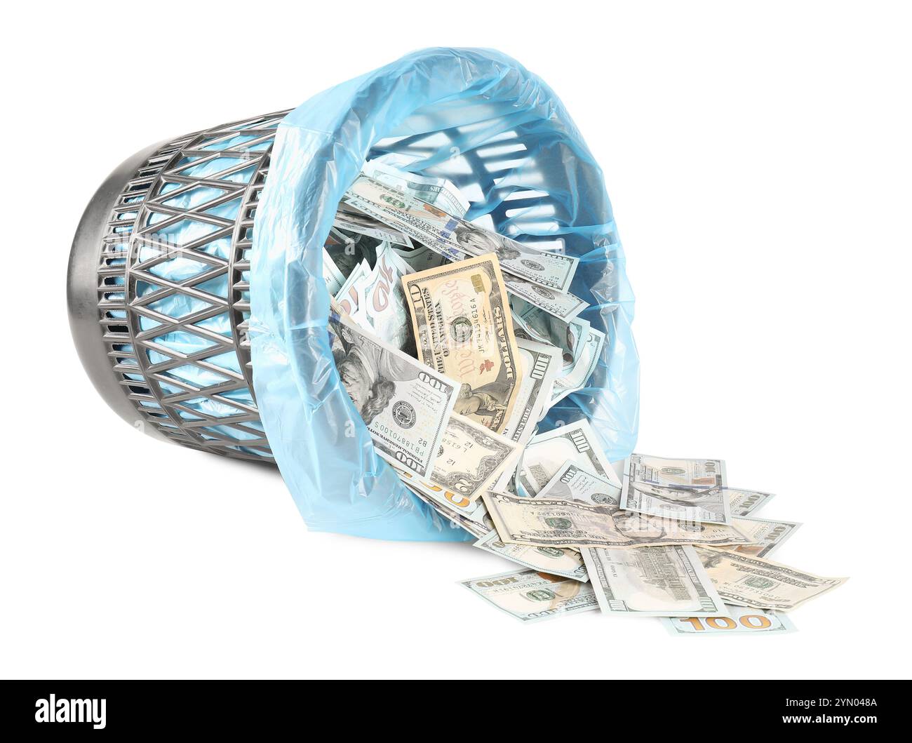 Many dollar banknotes and overturned trash bin isolated on white Stock ...