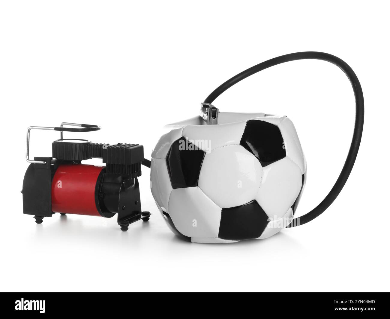 Deflated soccer ball and air compressor isolated on white Stock Photo ...