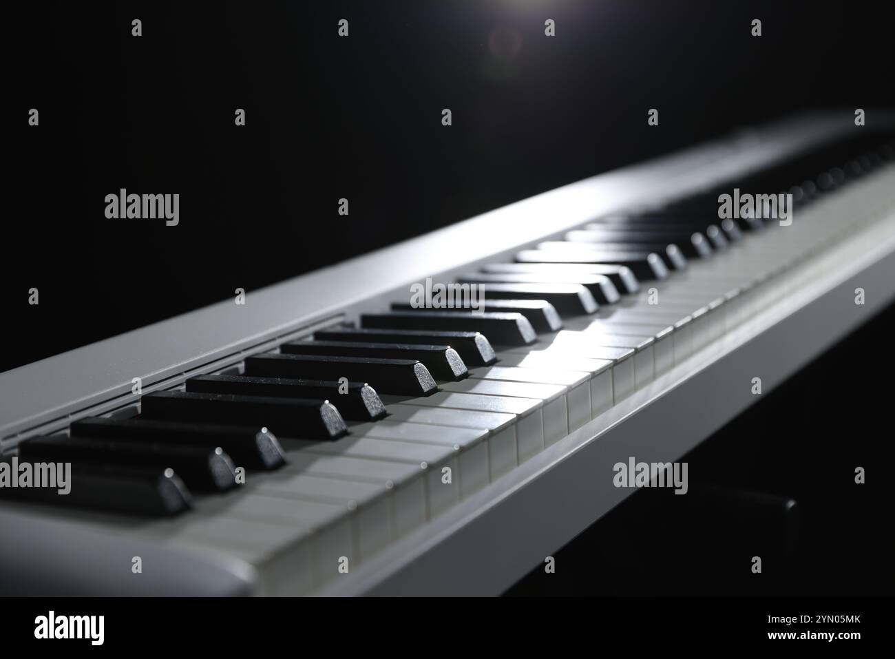Synthesizer on black background, closeup. Electronic musical instrument ...