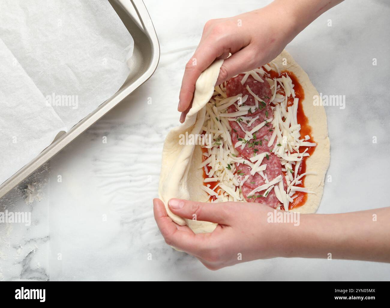 Woman making calzone pizza hi-res stock photography and images - Alamy
