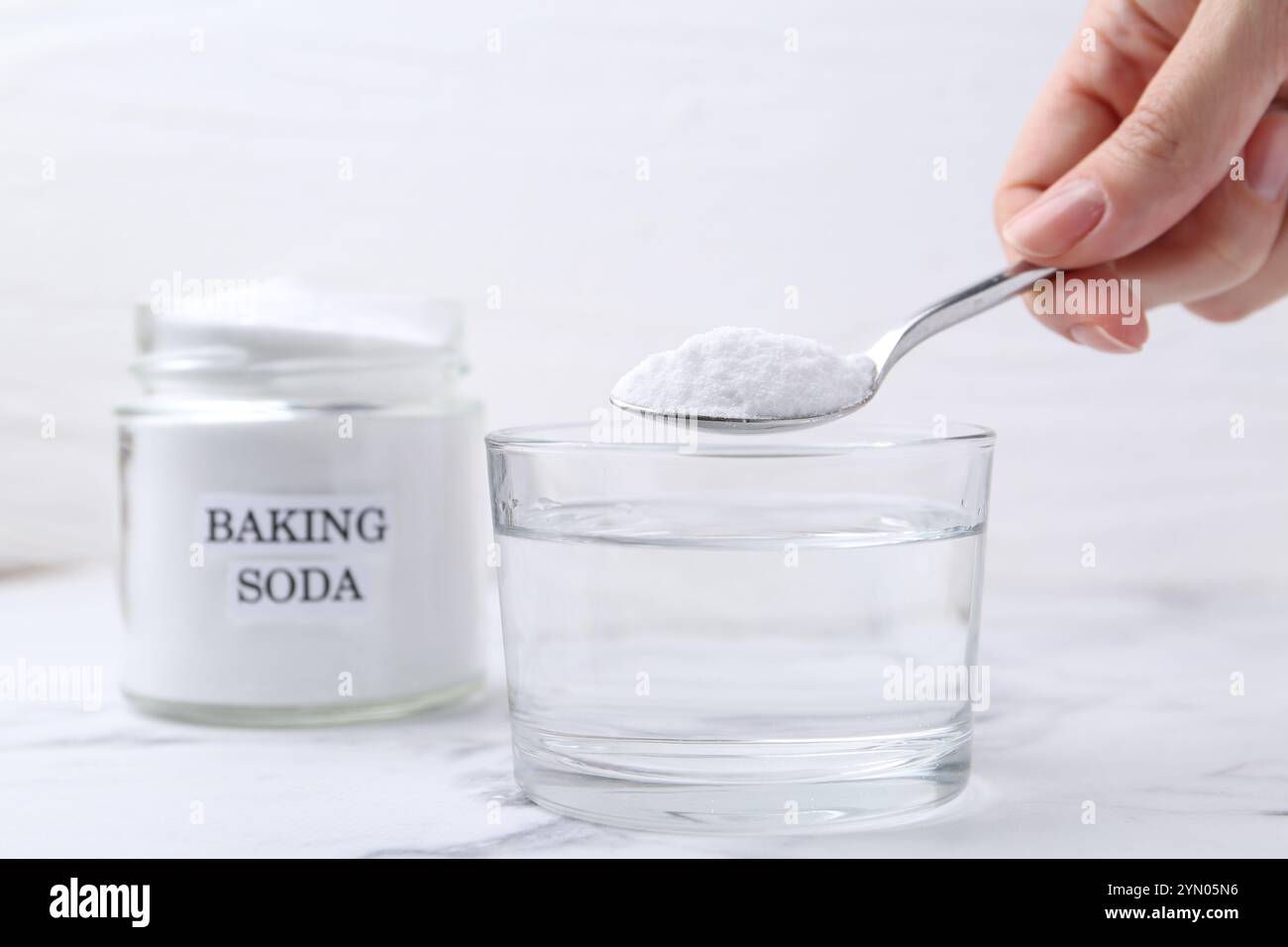 Woman adding baking soda hi-res stock photography and images - Alamy