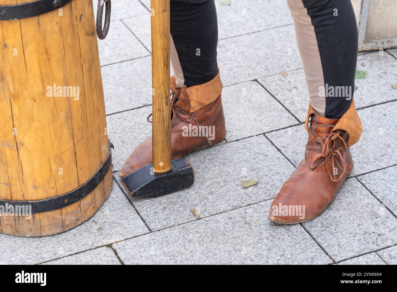 Medieval blacksmith and wooden hammer in historical setting Stock Photo ...