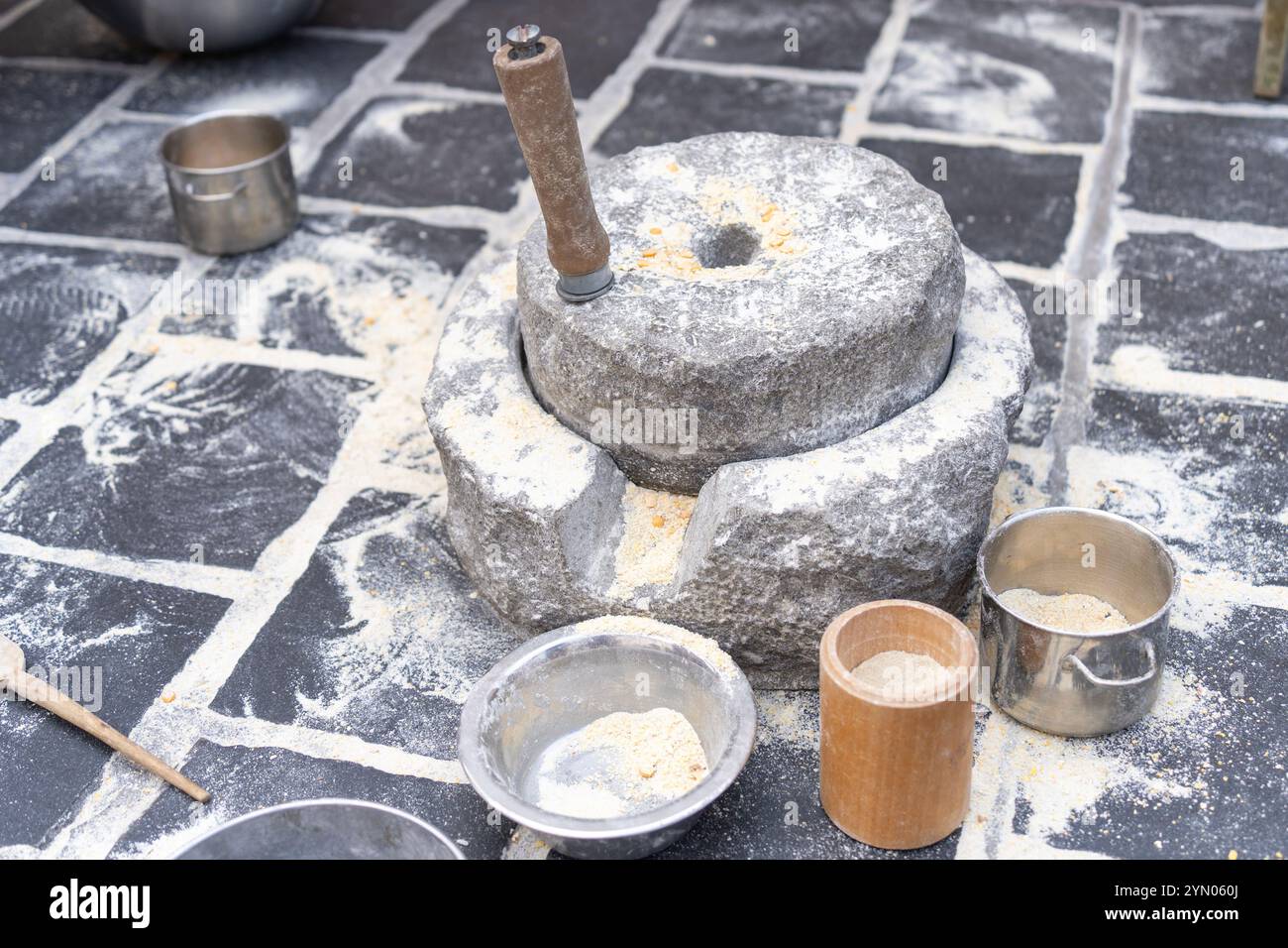 Traditional ancient stone mill for grinding grain Stock Photo - Alamy