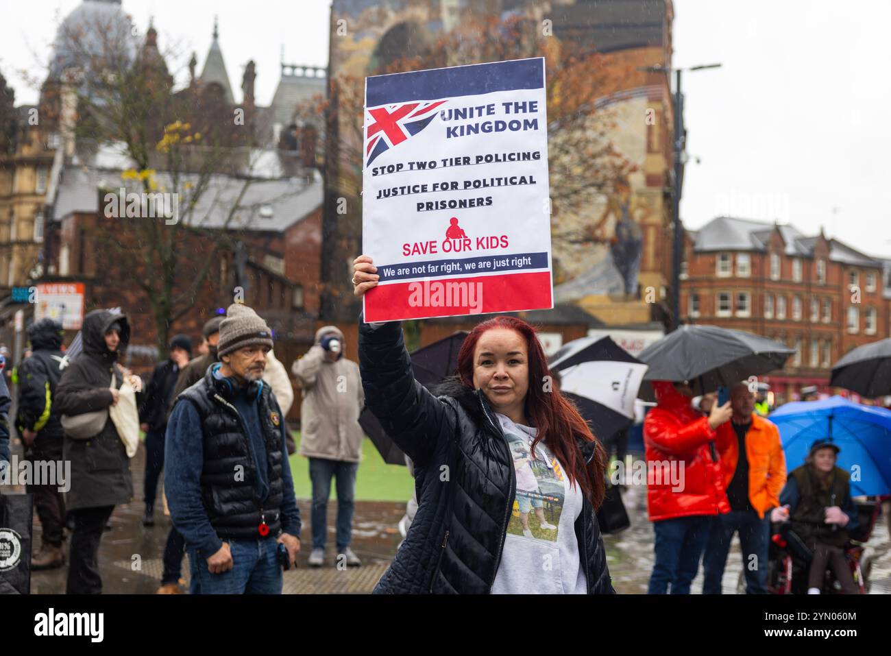 Leeds, UK. 23 NOV, 2024. lady holds "Unite the Kingdom, stop two tier ...