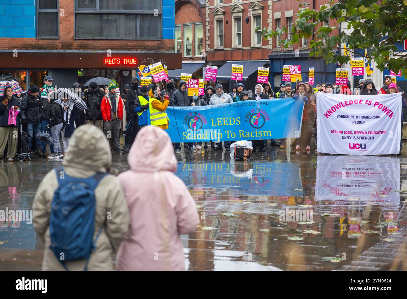 Leeds, UK. 23 NOV, 2024. Two bystanders watch on at the SUTR counter as ...