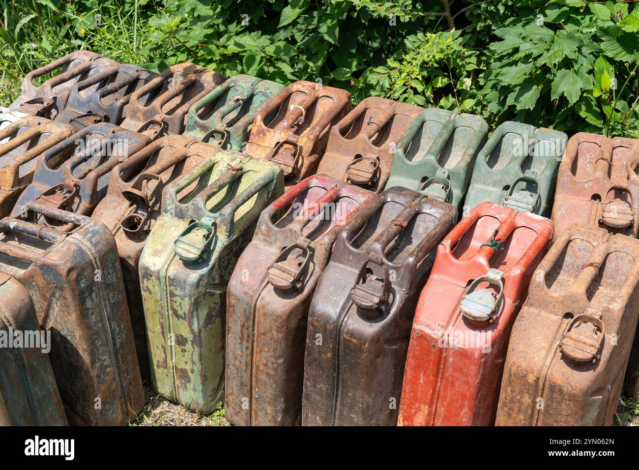 Old rusty WWII petrol cans outdoors Stock Photo - Alamy