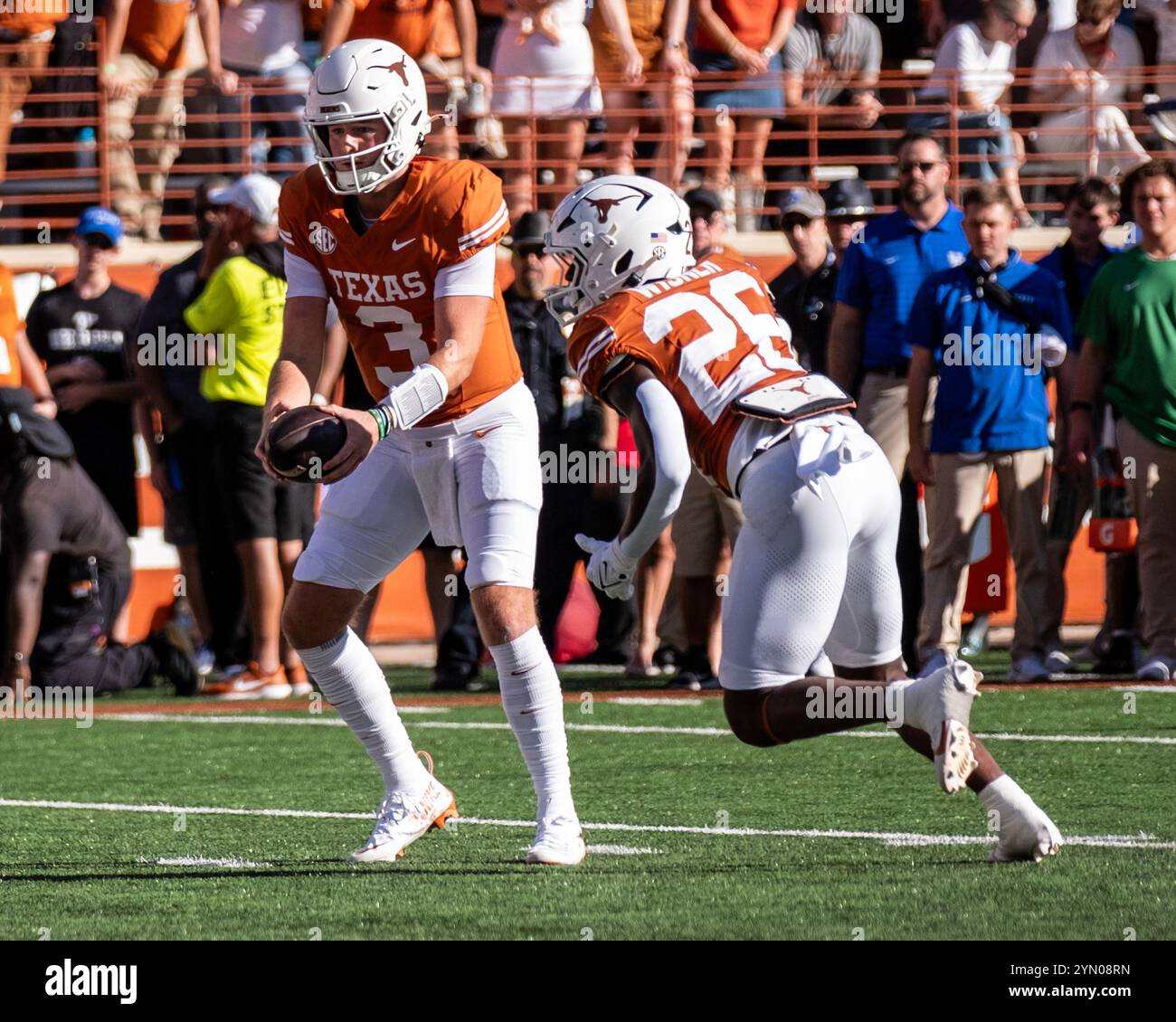 Nov 23, 2024.Quintrevion Wisner #26 gets the ball from Quinn Ewers #3 ...