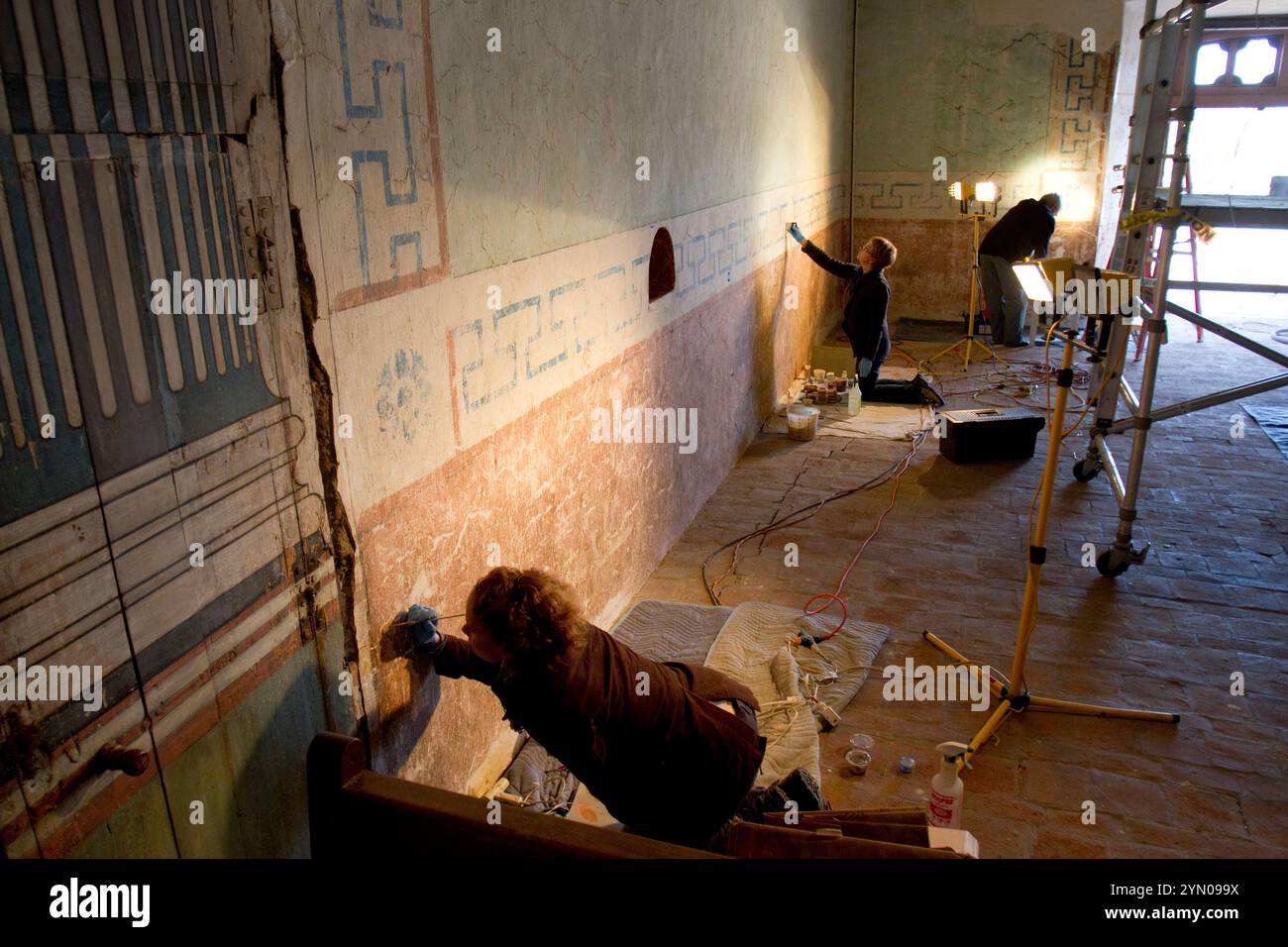 Specialists in art restoration work to repair the nearly 200 year old ...