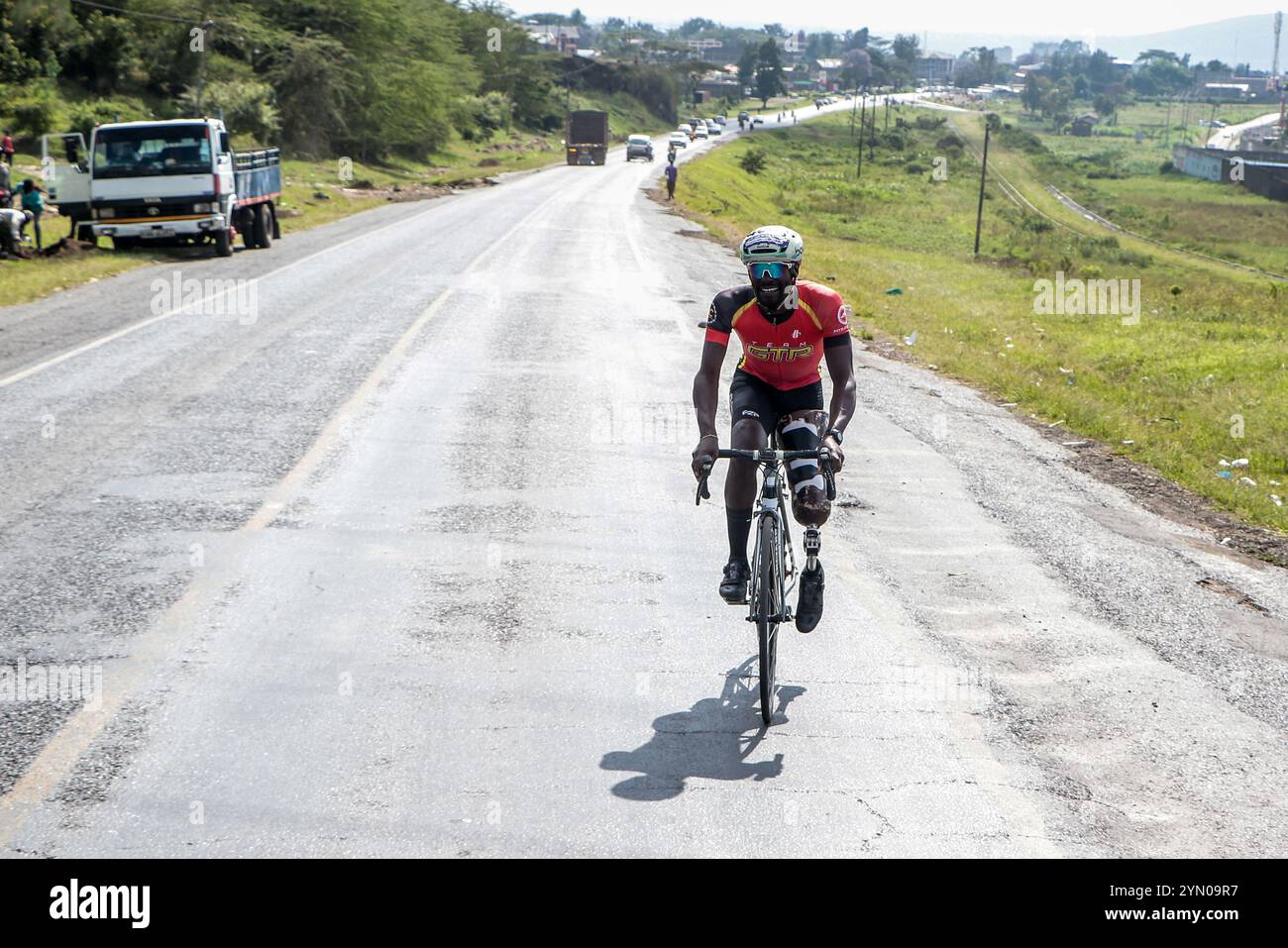 Nakuru, Kenya. 23rd Nov, 2024. An amputee cyclist takes part in a ...