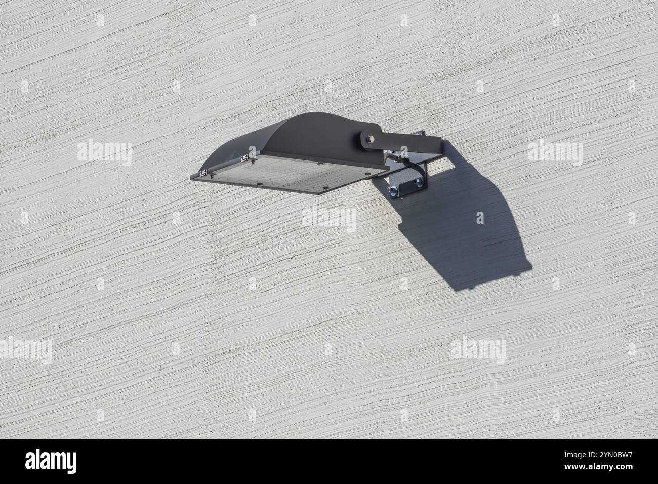 Spotlight on external concrete wall Stock Photo - Alamy