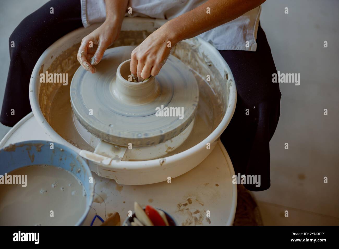 Crafting Pottery on a Wheel Engaging in Artistic Creation Through a ...
