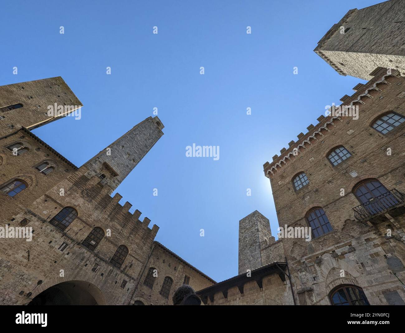 Wide angle sky view at the Piazza del Duomo in San Gimignano, Italy ...
