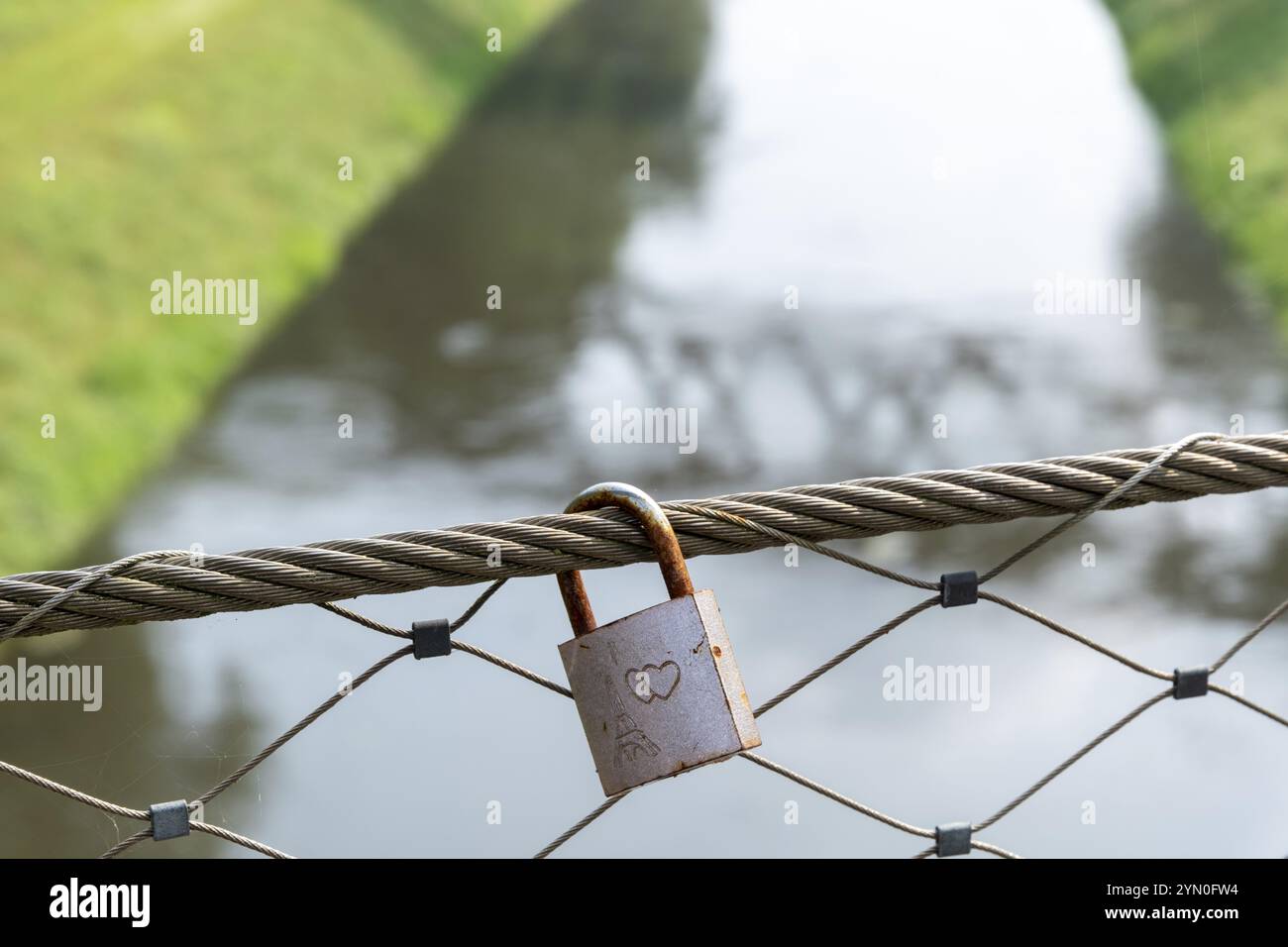 Love lock on railing over sewer Stock Photo - Alamy