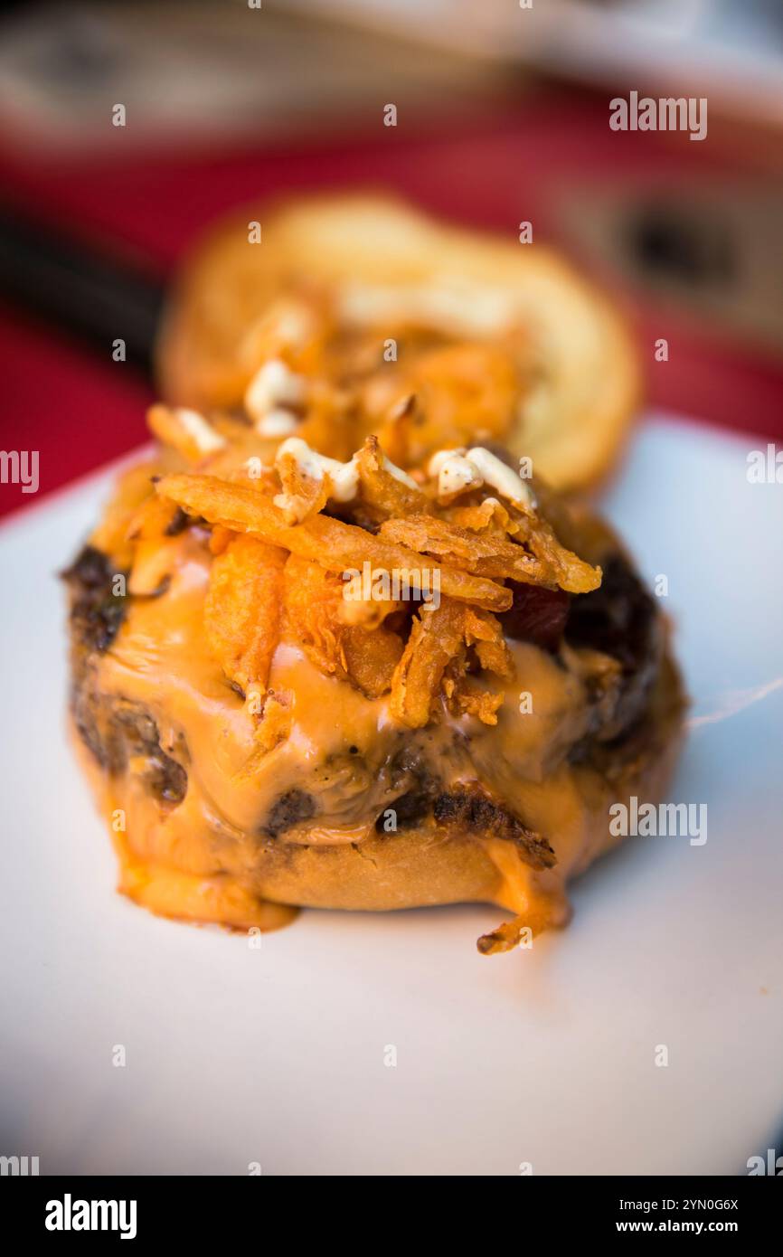 The "Manly Burger" comprised of beer-cheddar cheese, bacon lardons ...
