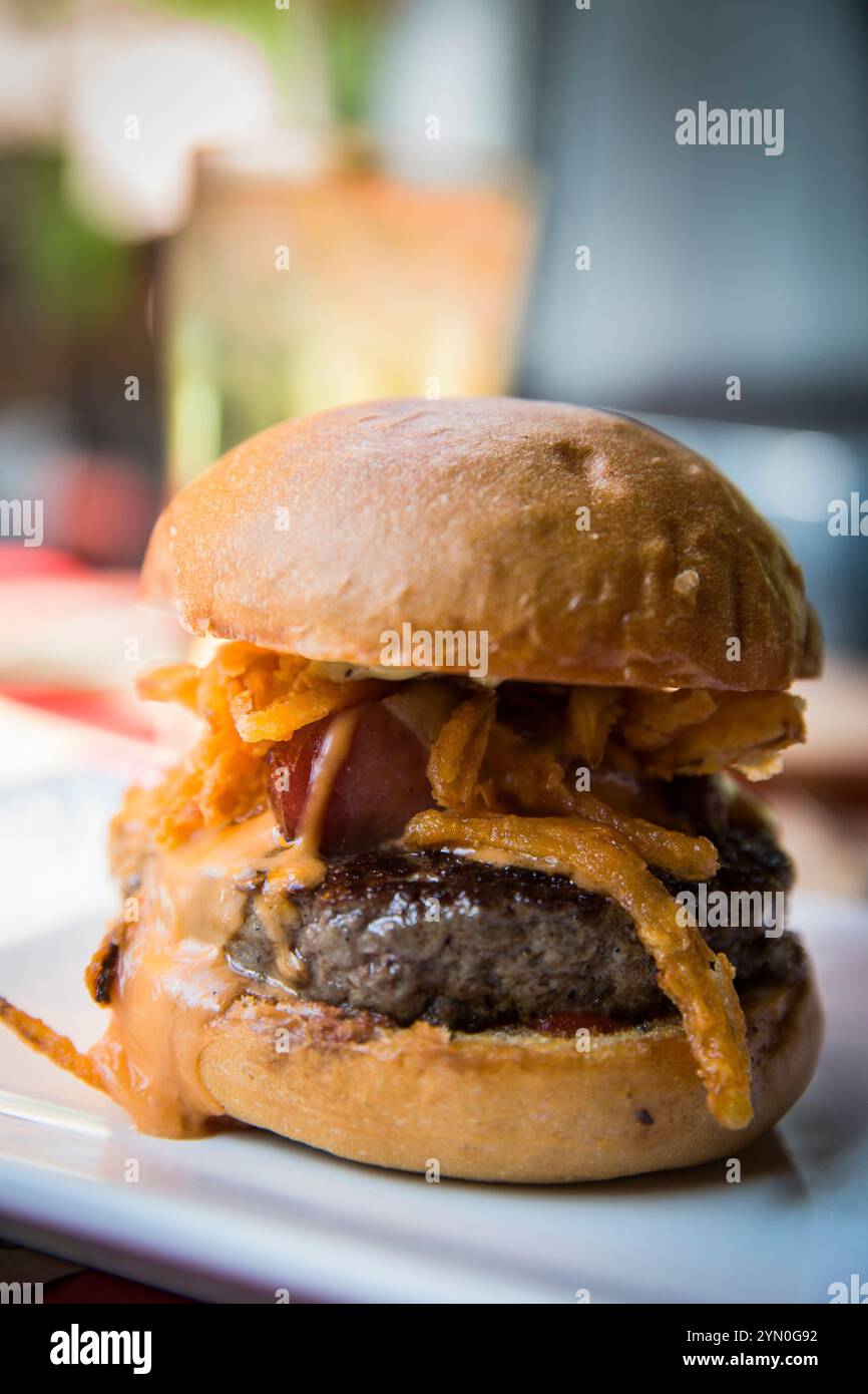 The "Manly Burger" comprised of beer-cheddar cheese, bacon lardons ...