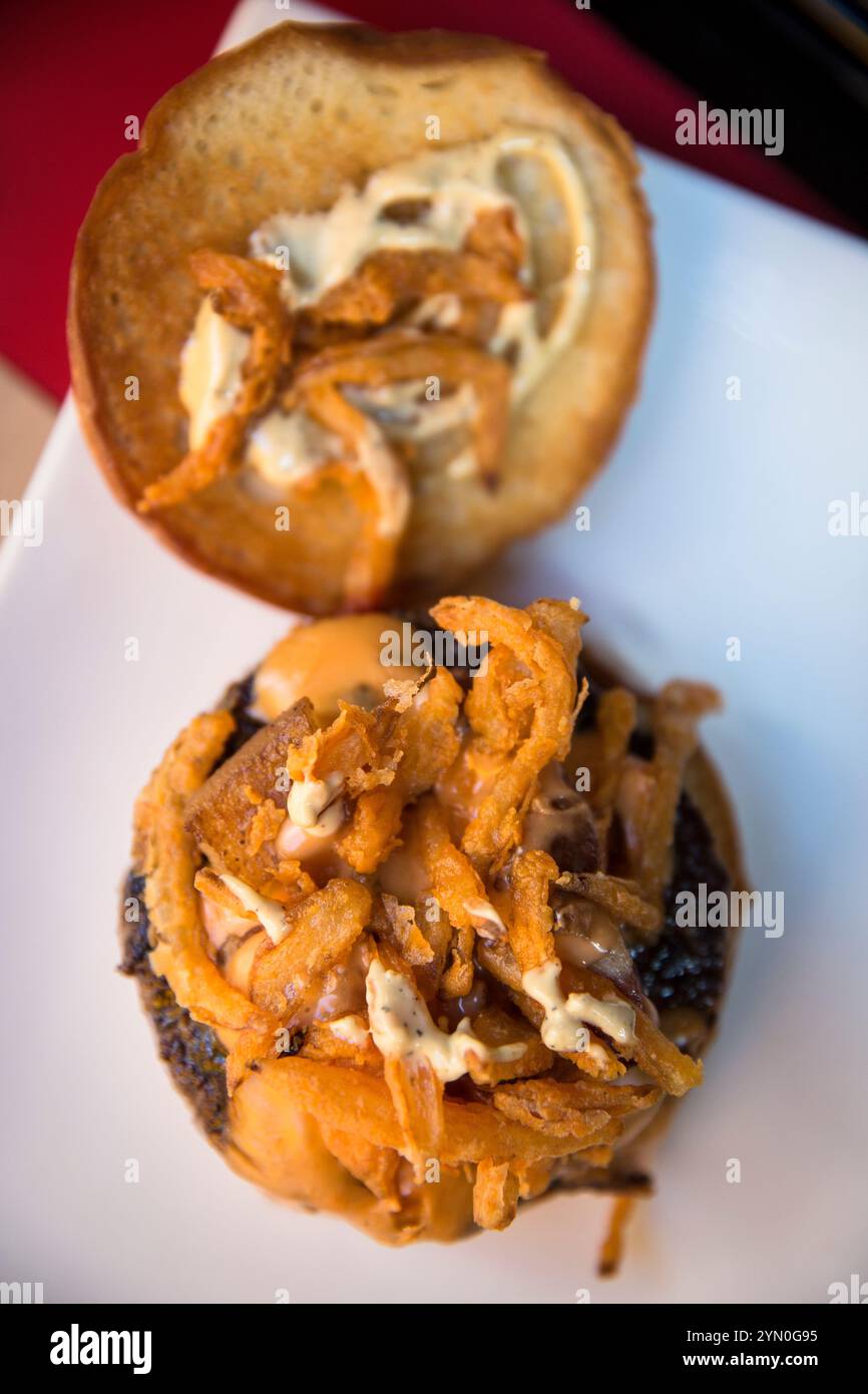The "Manly Burger" comprised of beer-cheddar cheese, bacon lardons ...