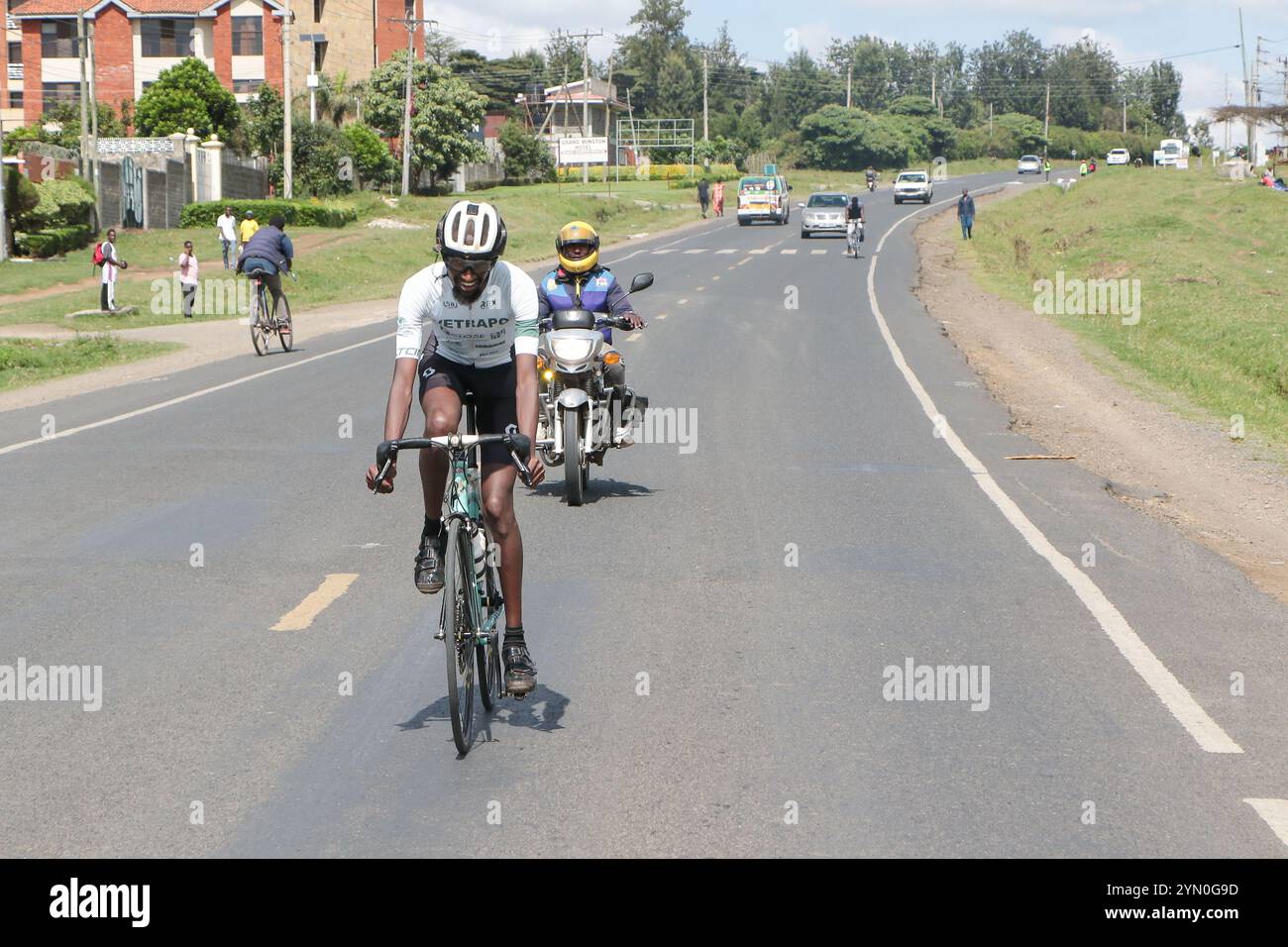 Nakuru, Kenya. 23rd Nov, 2024. A cyclist takes part in a competition ...