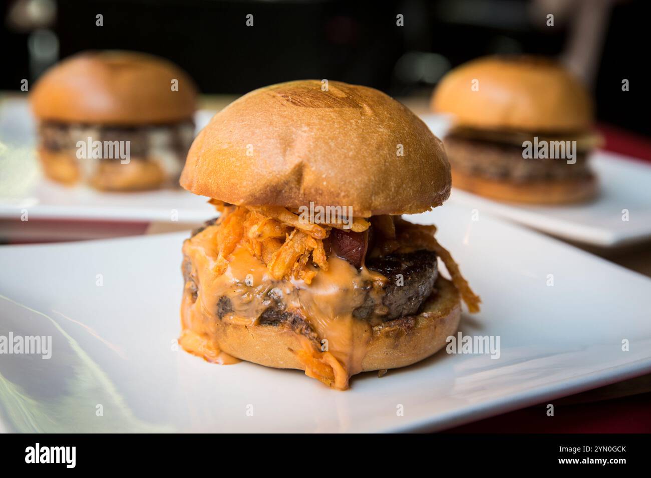 The "Manly Burger" comprised of beer-cheddar cheese, bacon lardons ...
