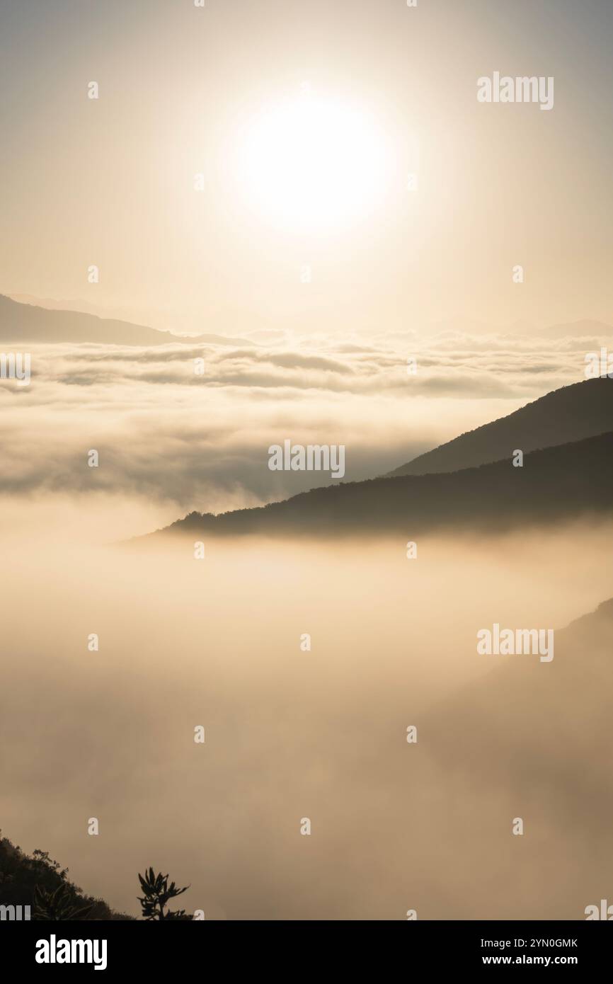 Amber sunrise above low clouds and mountain ridges in Los Angeles ...