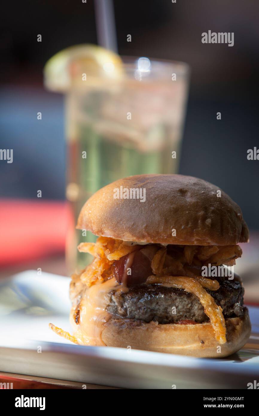 The "Manly Burger" comprised of beer-cheddar cheese, bacon lardons ...