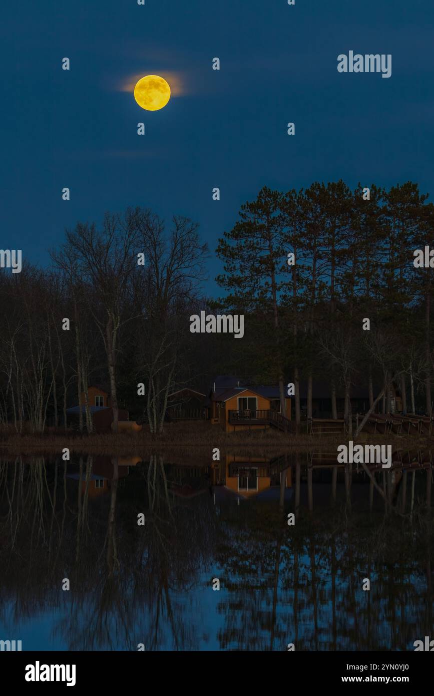 The beaver moon rising over Blaisdell Lake in northern Wisconsin Stock ...