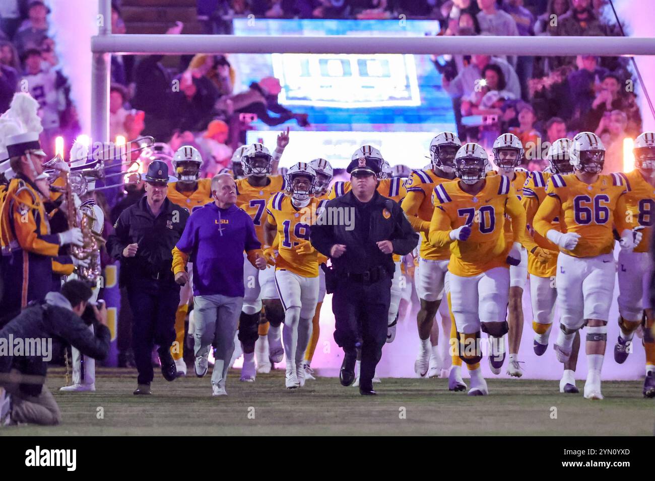 Baton Rouge, LA, USA. 23rd Nov, 2024. LSU Head Coach Brian Kelly leads his team onto the field ...