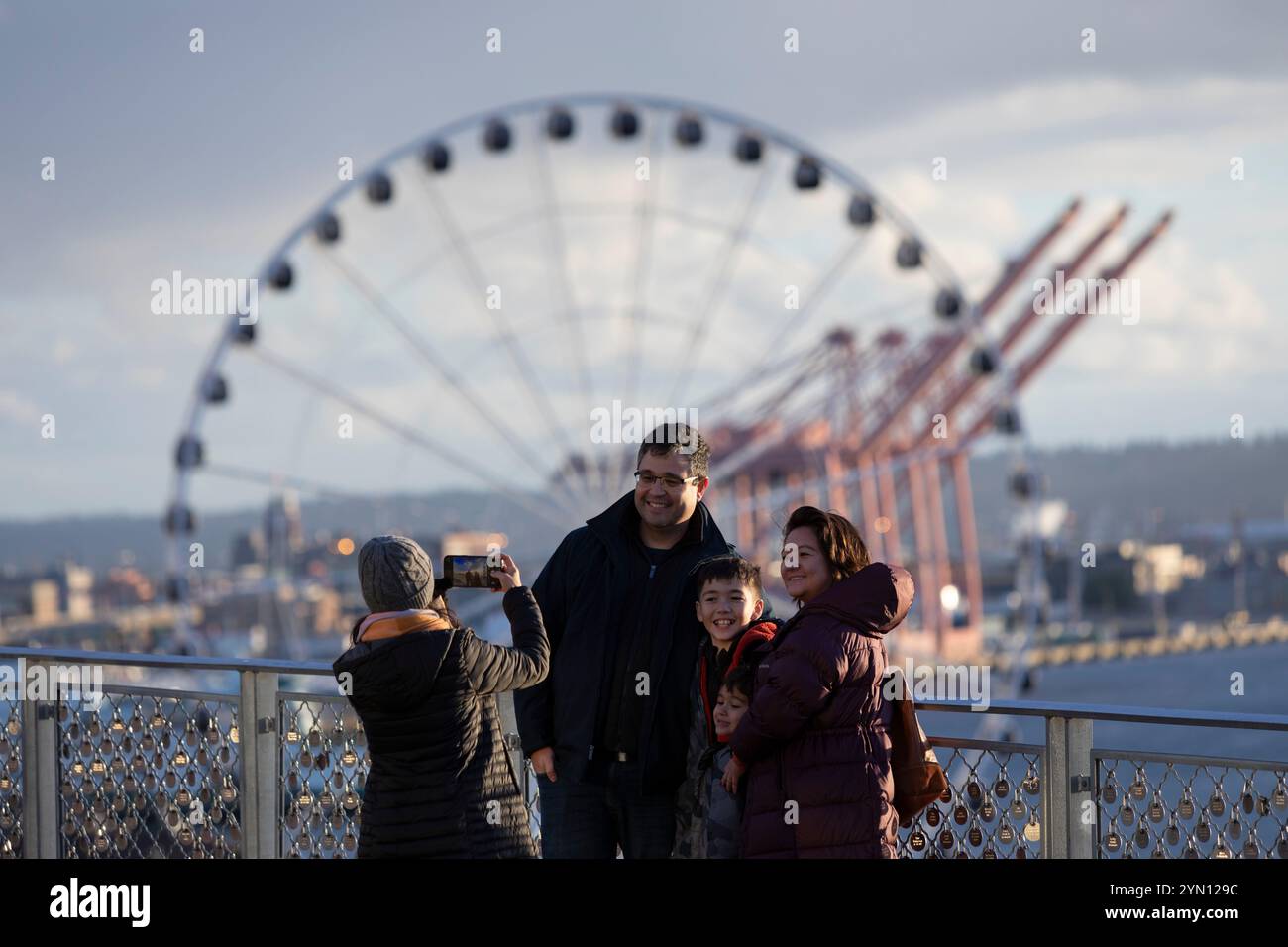 A family takes a photo along the Seattle Waterfront at Seattle's new ...