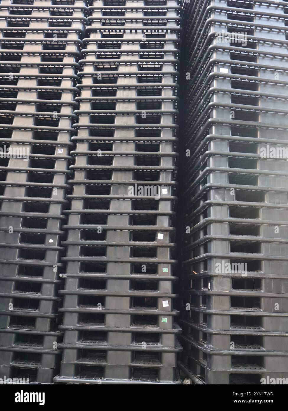 Balikpapan-East kalimantan November 23,2024 Stack of many black Plastic ...