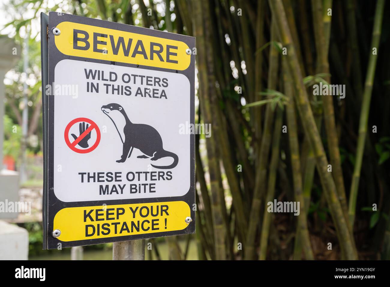 Beware of wild otters in this area sign located in the park Stock Photo ...