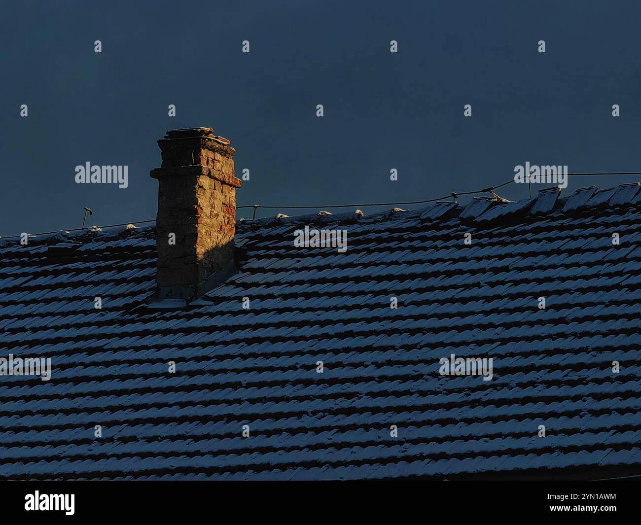 Rustic Rooftop: Sunlit Brick Chimney Against Clear Blue Sky Stock Photo ...