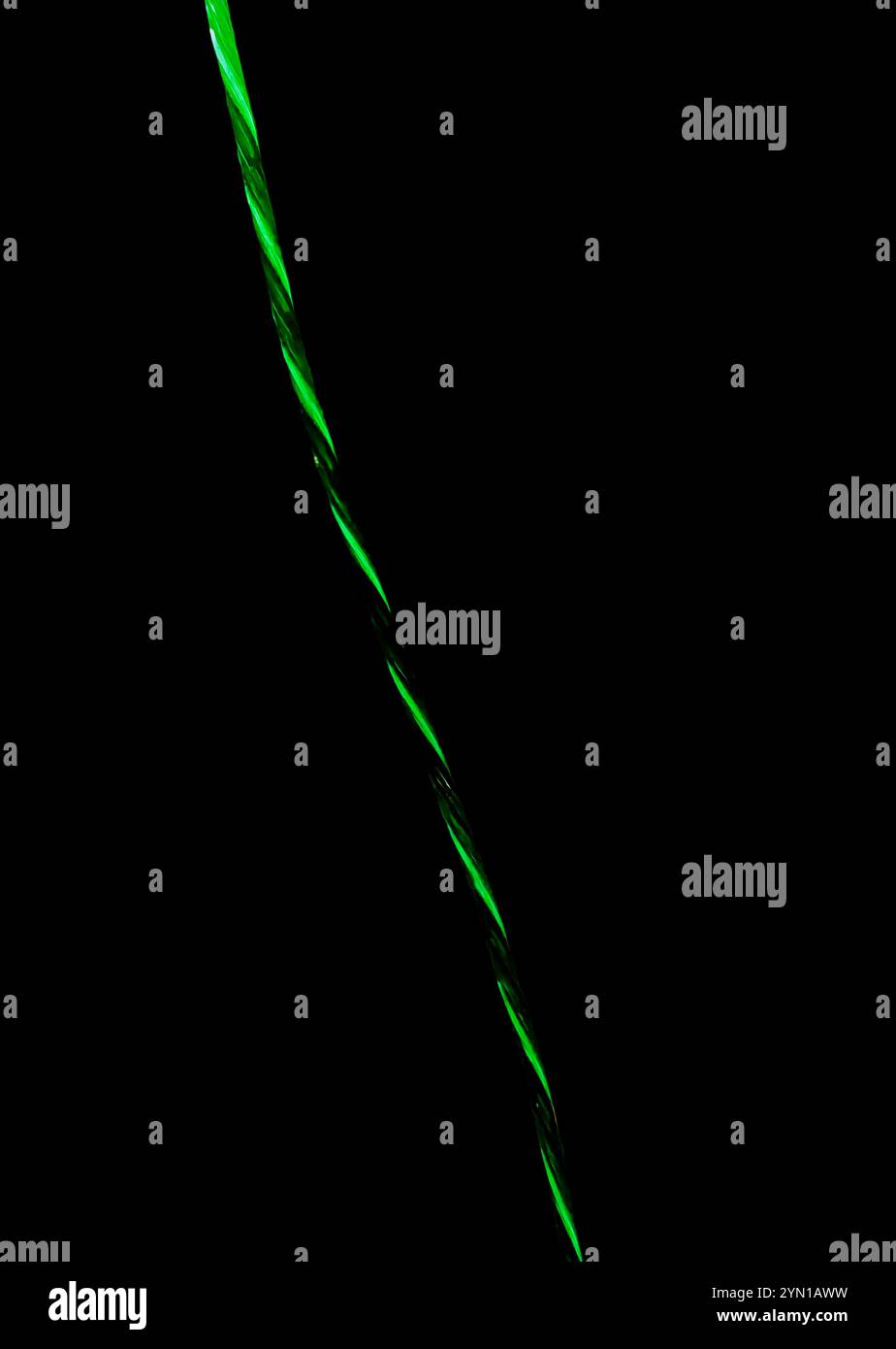 Electric Glow: Green Charger Cable Illuminating the Darkness Stock ...