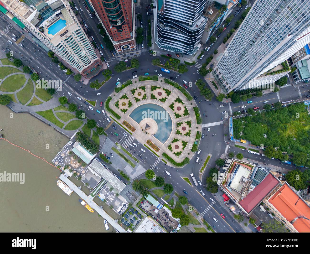 A city view with a large round plaza in the middle. The plaza is ...