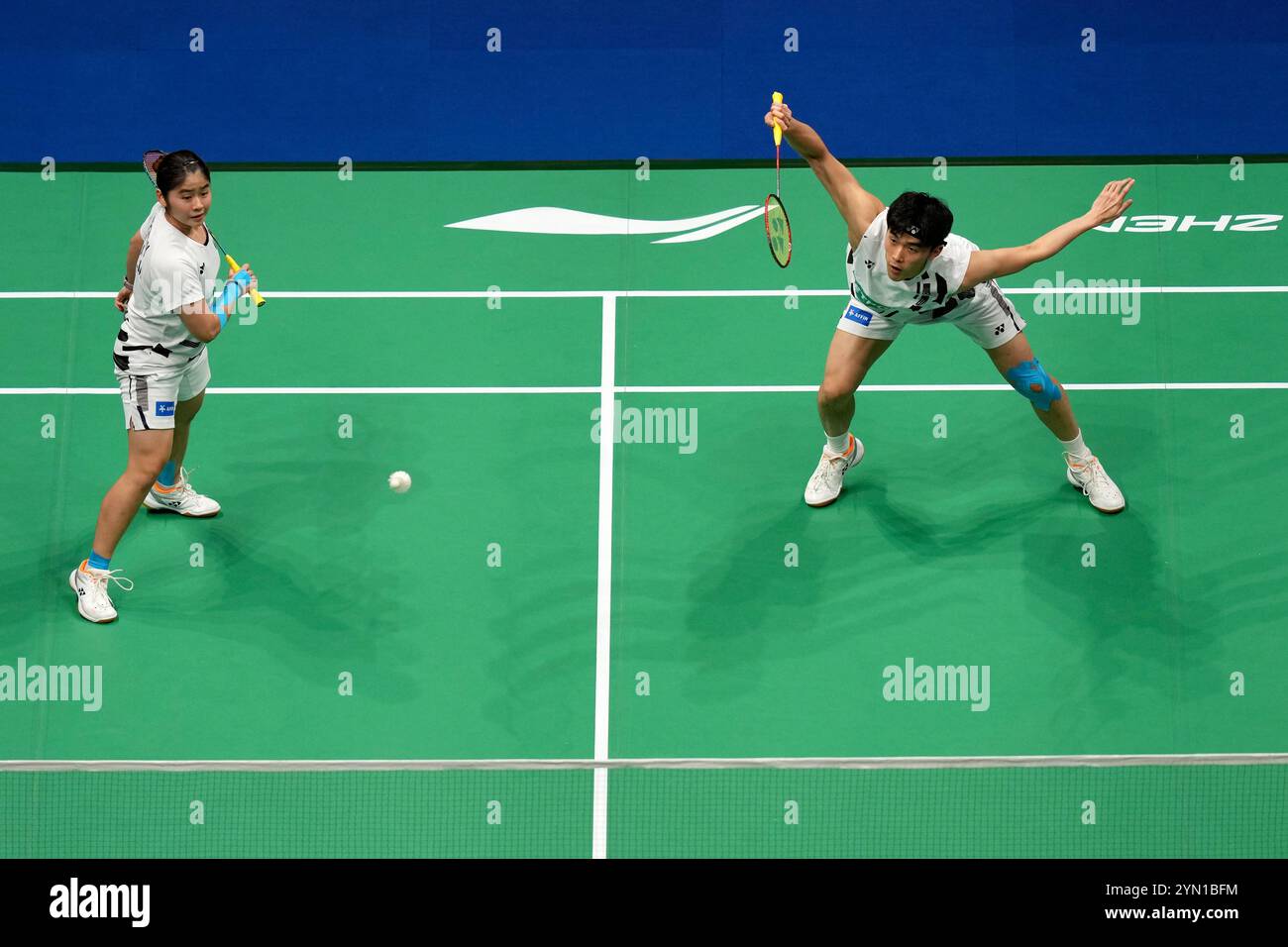 Hoo Pang Ron, right, and Cheng Su Yin of Malaysia play against Feng Yan Zhe and Huang Dong Ping ...