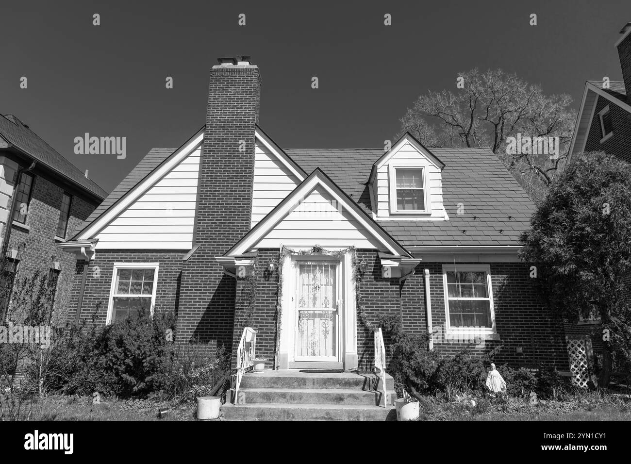 vintage cottage style home in residential neighborhood. neighborhood ...